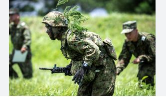 Beijing warns Japan's 'new militarism' poses threat to global peace ...